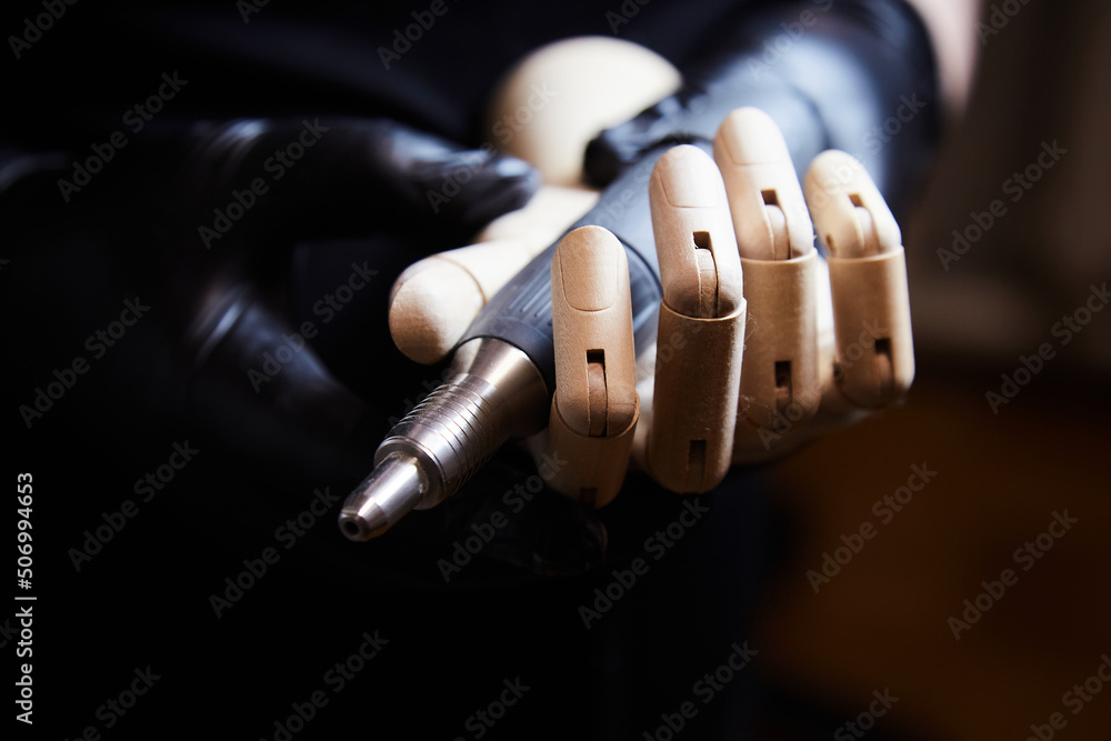 Manicure in the salon, wooden doll hand with a manicure and pedicure ...