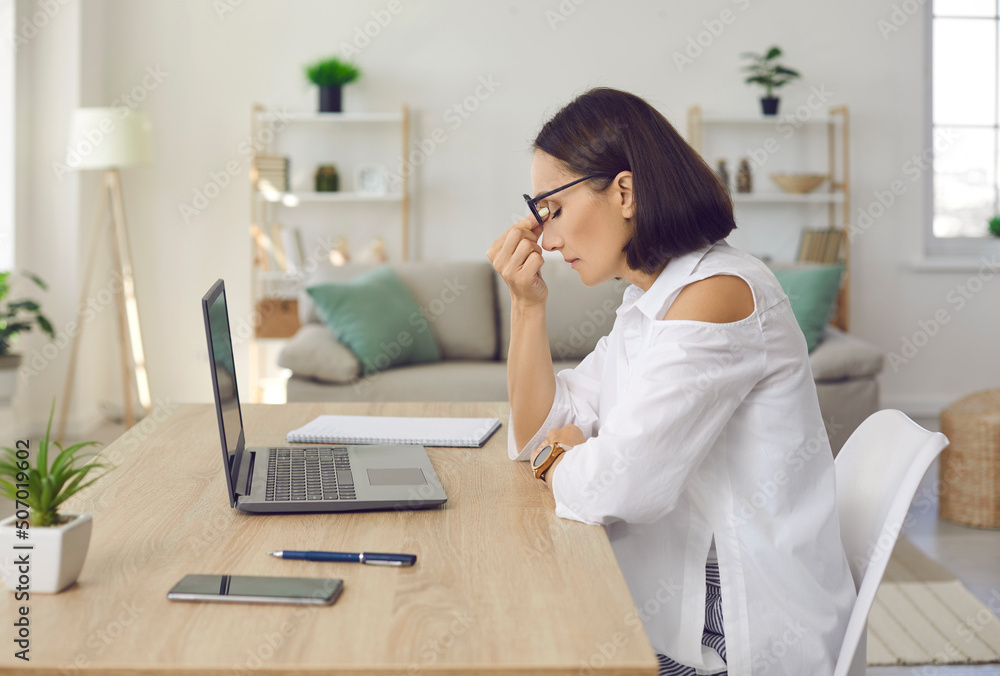 Stressed exhausted woman sitting in front of laptop computer screen ...