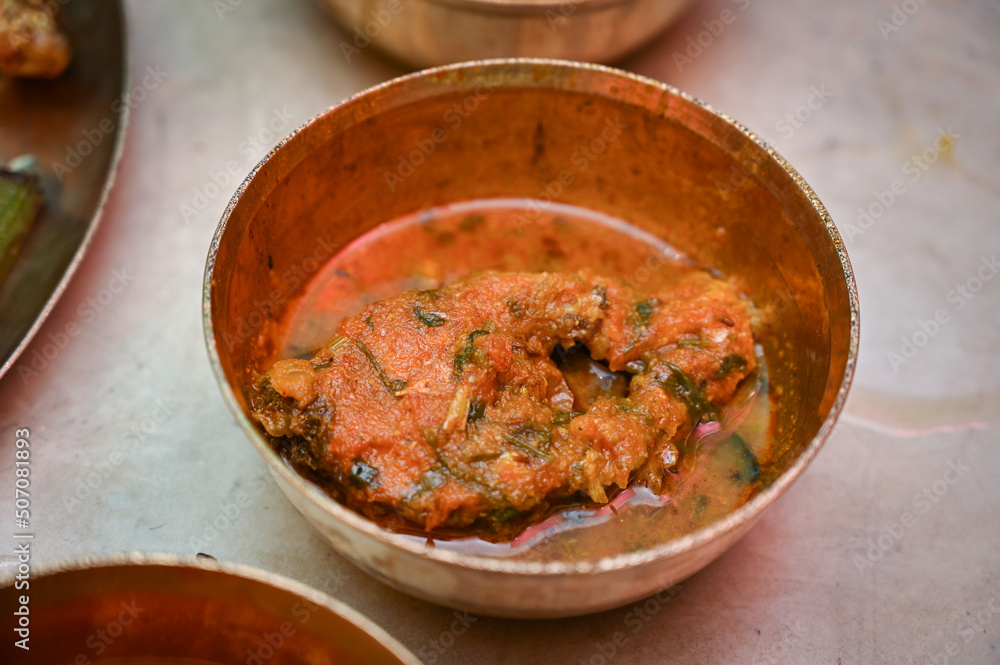 Bengali fish curry masala gravy. Cooking spicy Catla fish curry , India ...