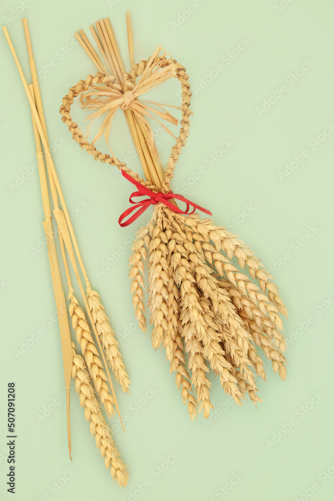 Traditional straw corn dolly with wheat sheaths. Ancient pagan symbol ...