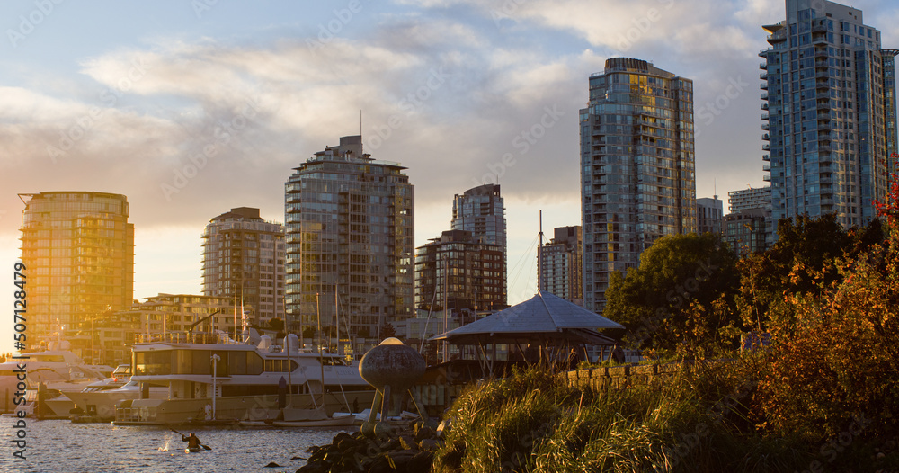 Sunset with beautiful beachfront buildings and skyline Vancouver Canada ...