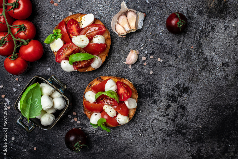 Caprese toasts with mozzarella, cherry tomatoes and fresh garden basil ...
