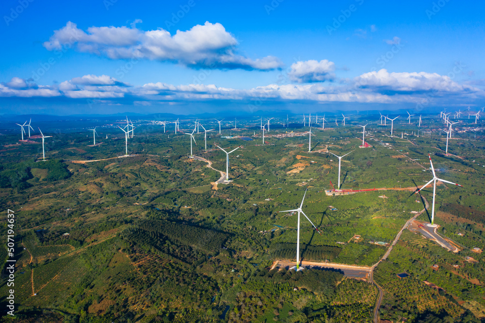 Wind turbines on beautiful sunny mountain and forest landscape. Green ...