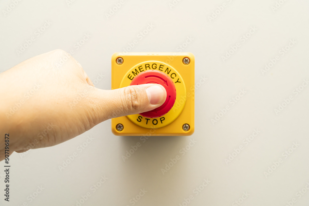 Stop Button and the Hand of Worker About to Press it. emergency stop ...