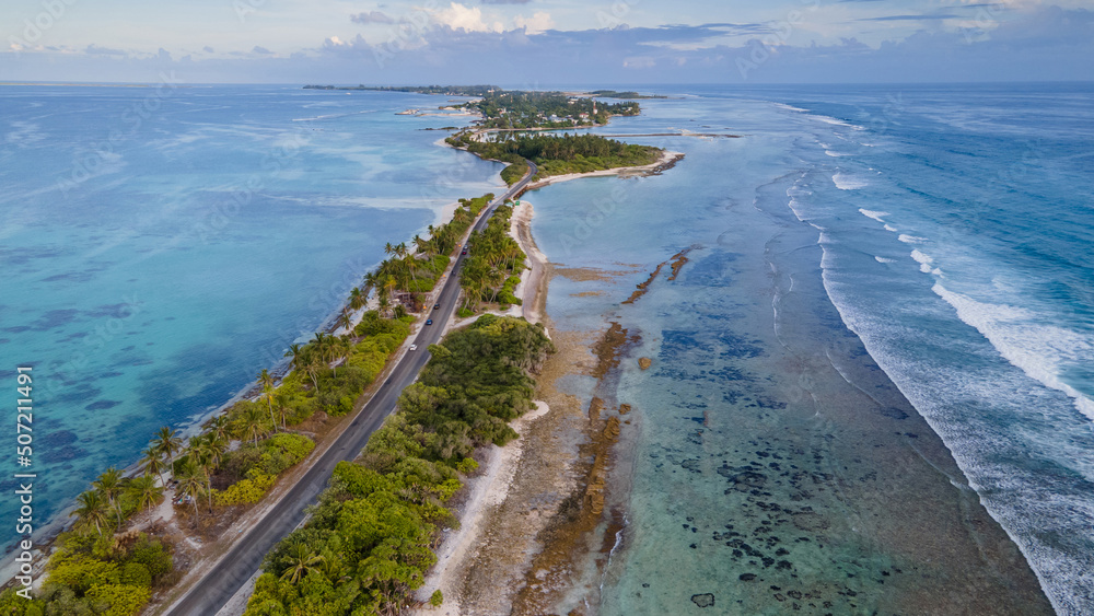 Aerial view of tropical beach landscape and local road at addu city ...