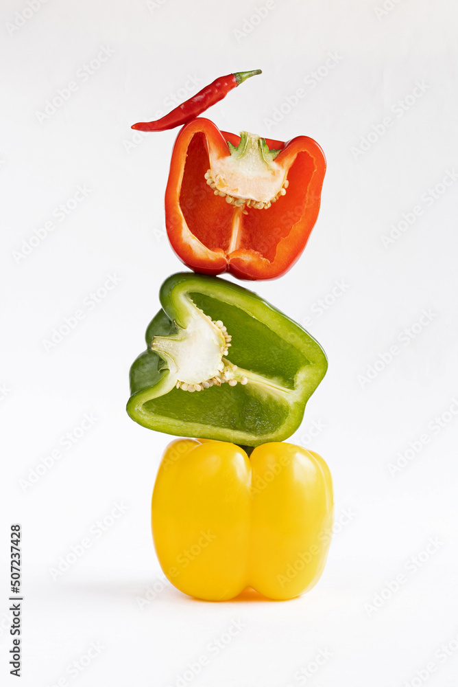 Pyramid of colorful peppers or paprika, chili peppers on a white ...
