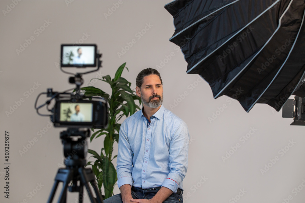 Behind the Scenes of Man Sitting on Chair on Video Production Set in ...