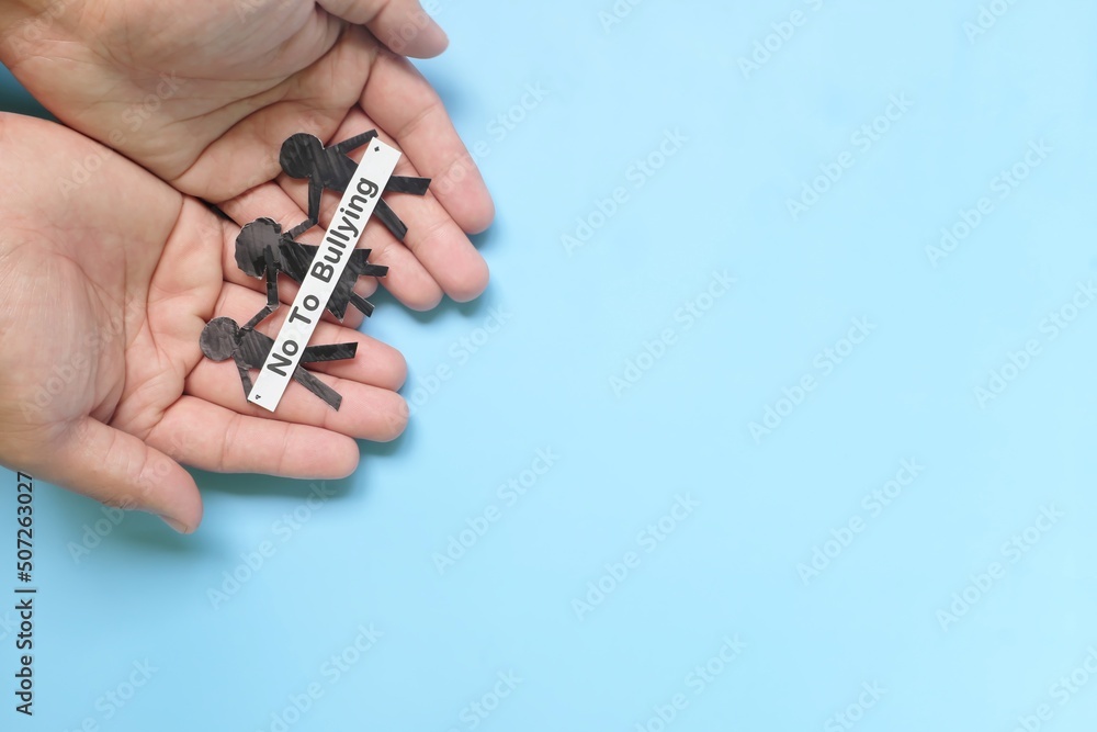 Anti-bullying and stop child bullying concept. Hand holding children ...
