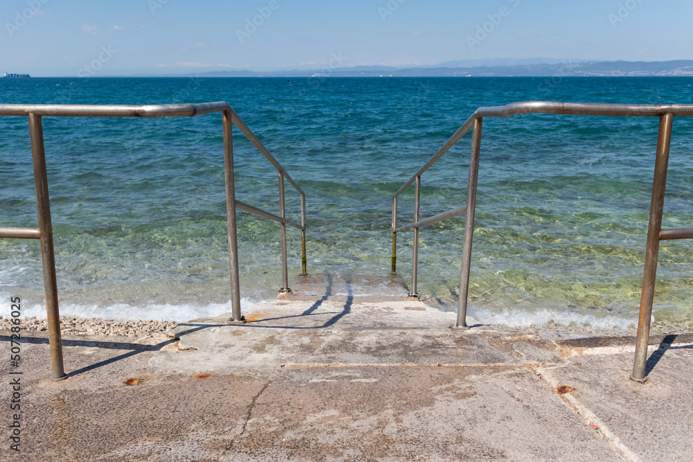 Accessible beach with ramp for people with disability using wheelchair ...