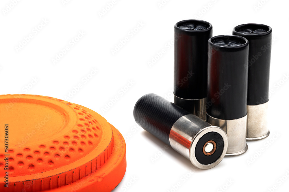 Clay disc flying targets and shotgun bullets on white background ,Clay ...