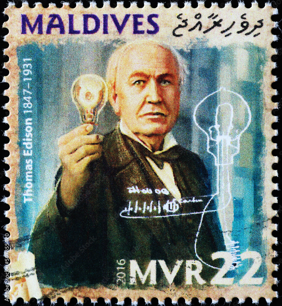 Thomas Edison showing his lamp on postage stamp Stock Photo | Adobe Stock