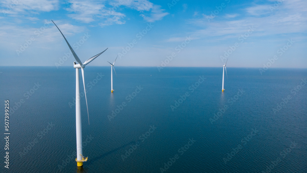 Windmill park in the ocean, drone aerial view of windmill turbines ...