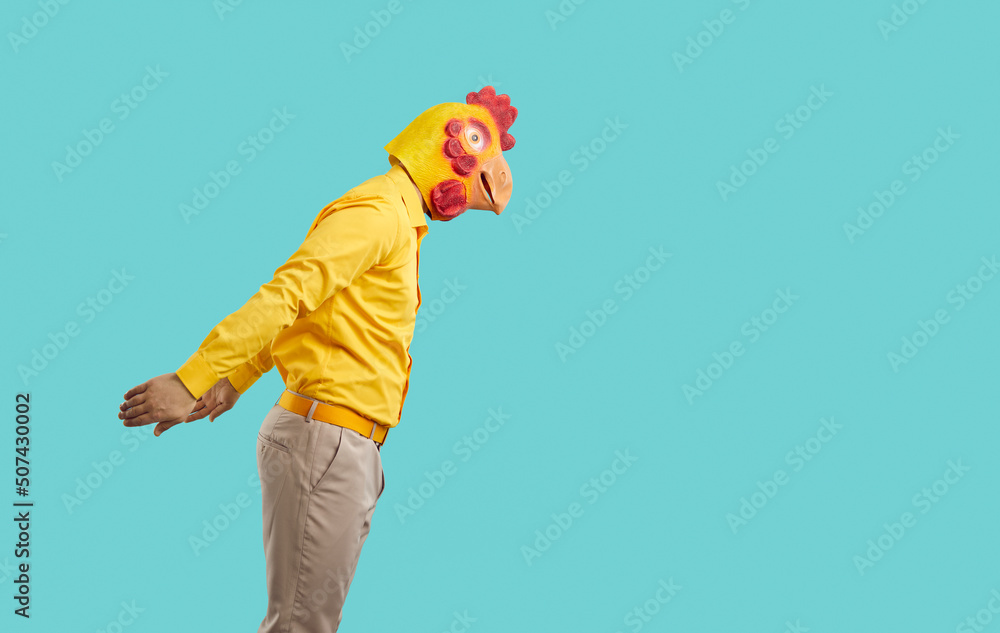 Guy in funny bird disguise getting ready to jump in water. Side view of ...