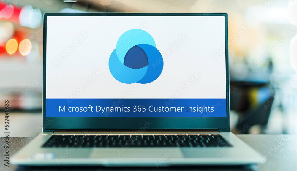 Computer with logo of Microsoft Dynamics 365 Customer Insights Stock ...