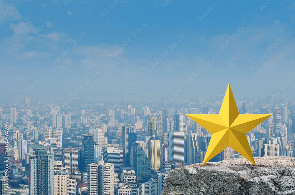Gold star on rock mountain over modern city tower, office building and ...