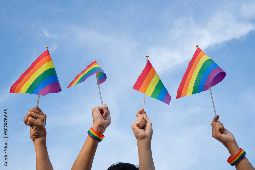 diversity people hands raising colorful lgbtq rainbow flags together ...