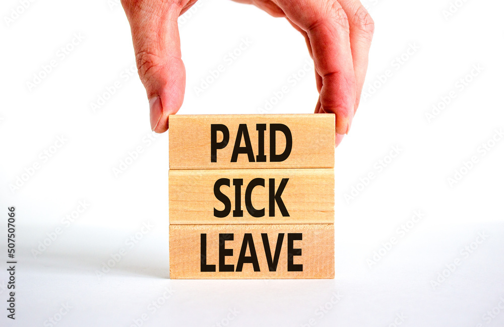 Paid sick leave symbol. Concept words Paid sick leave on wooden blocks ...