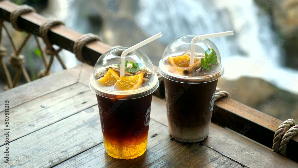 Refreshment drinks in plastic cups with straws for takeaway. Iced ...