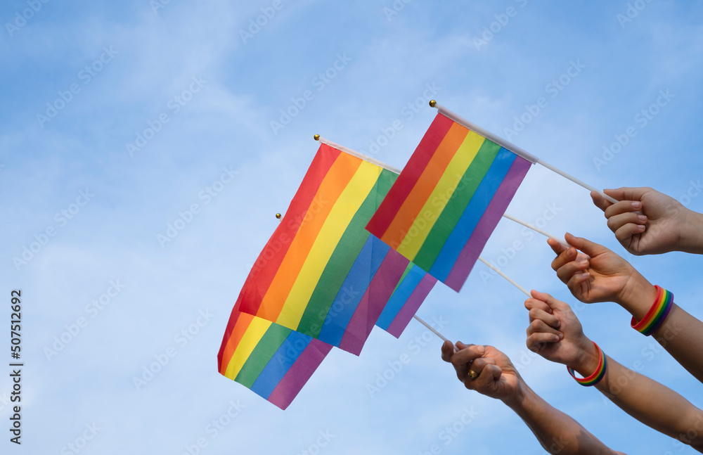 diversity people hands raising colorful lgbtq rainbow flags together ...