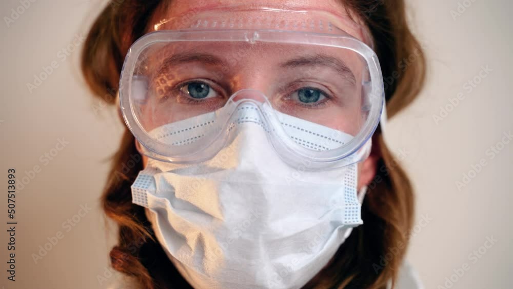 Female doctor during coronavirus pandemic covid-19 takes off glasses ...