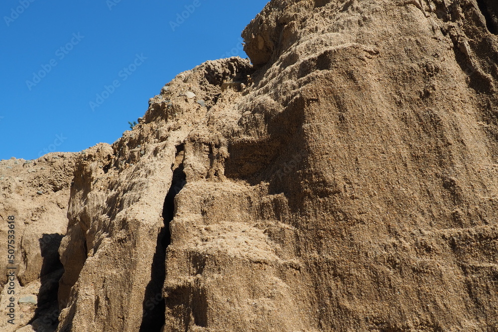Sandstone is a fragmentary sedimentary rock, a homogeneous or layered ...