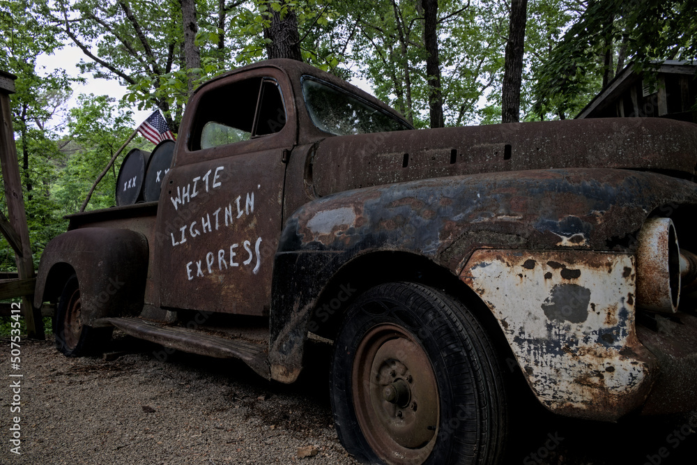 Old rusty broken down truck with oak barrels casks in back hauling ...