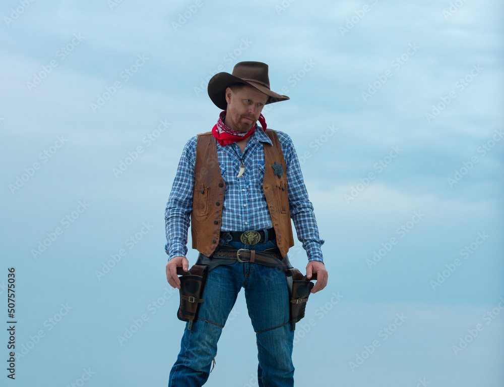 Cowboy in black suit and cowboy hat. Man with west vintage pistol ...