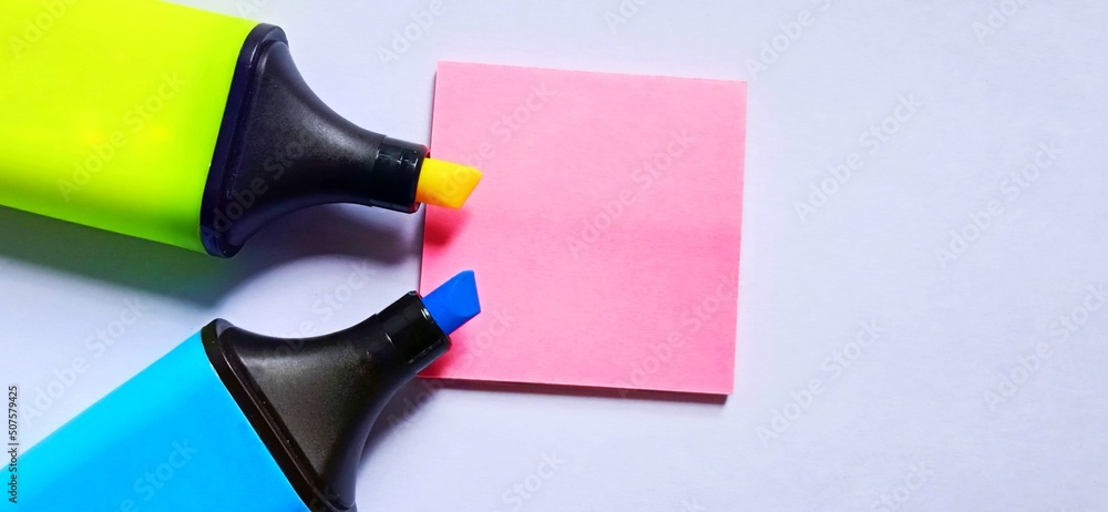 Isolated blue and yellow markers and isolated pink square note on the ...
