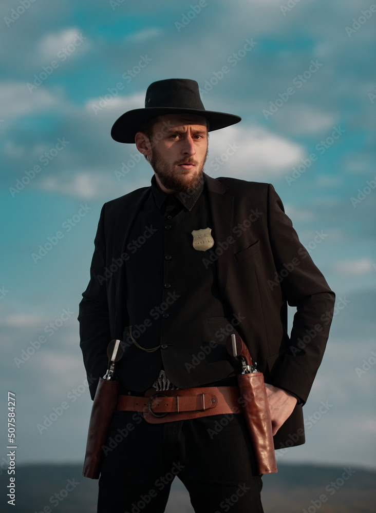 Sheriff or cowboy in black suit. Man with vintage pistol revolver and ...