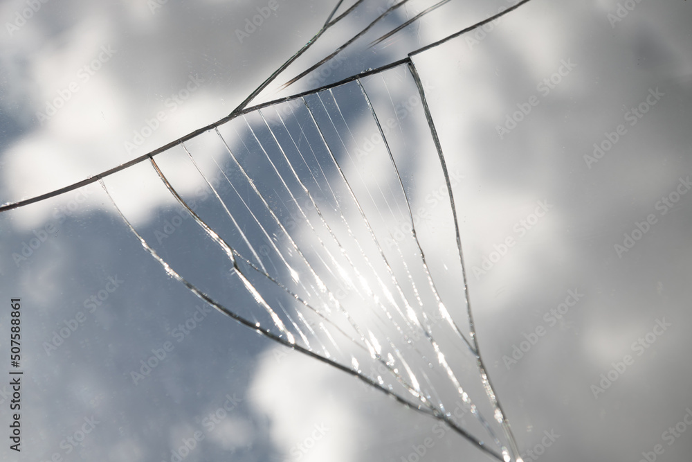 broken glass of mirror reflecting the blue sky with clouds Stock Photo ...