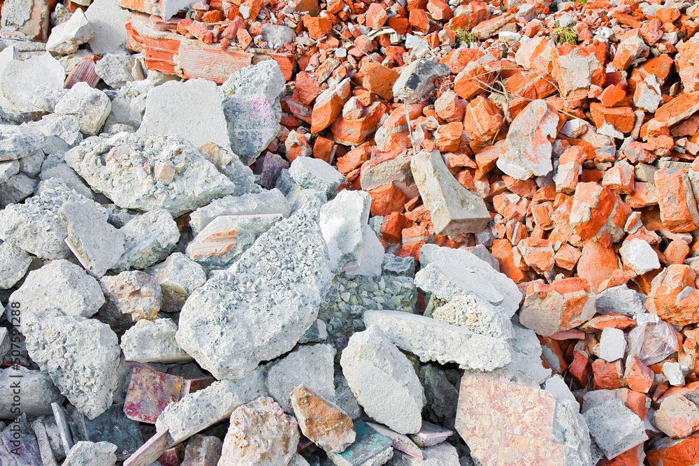 Concrete and brick rubble debris on construction site after a ...