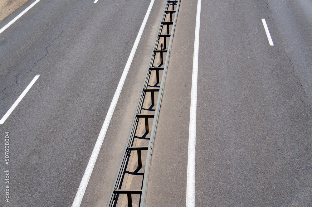 Top view of the road markings on the asphalt road highway. Metal ...