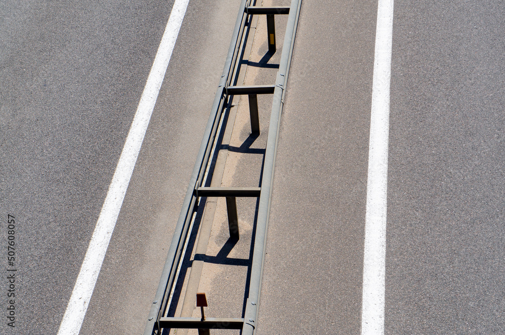 Top view of the road markings on the asphalt road highway. Metal ...