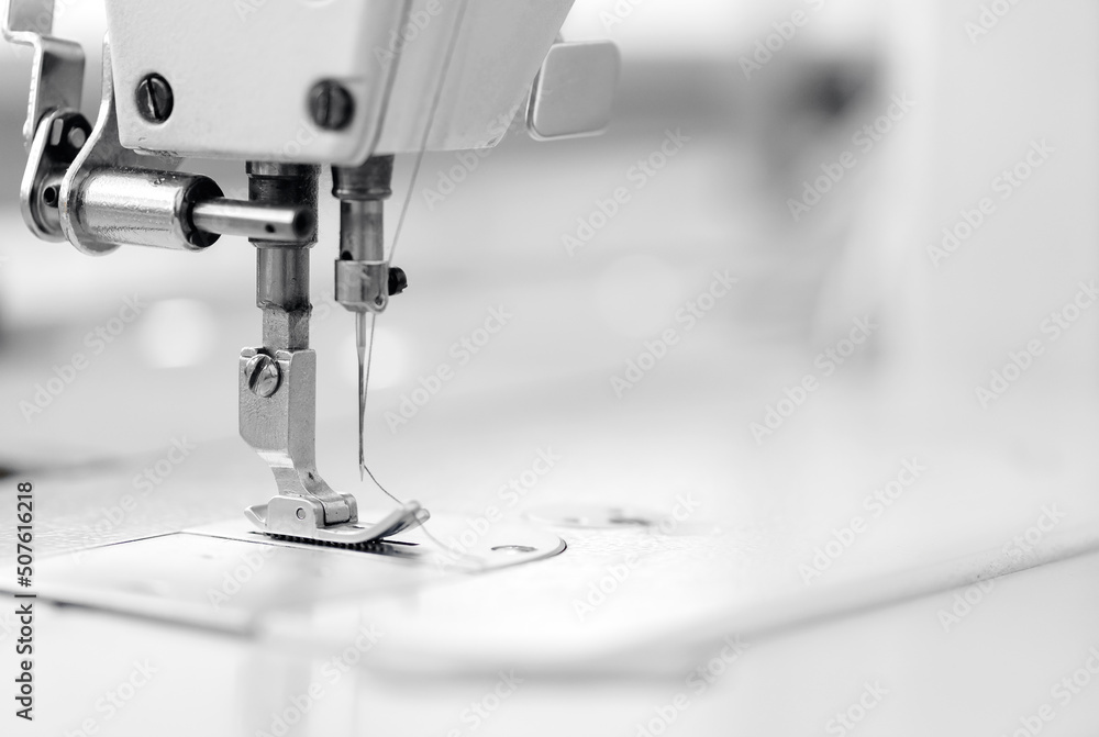 Banner industry tailor sewing machine on table workshop of white ...
