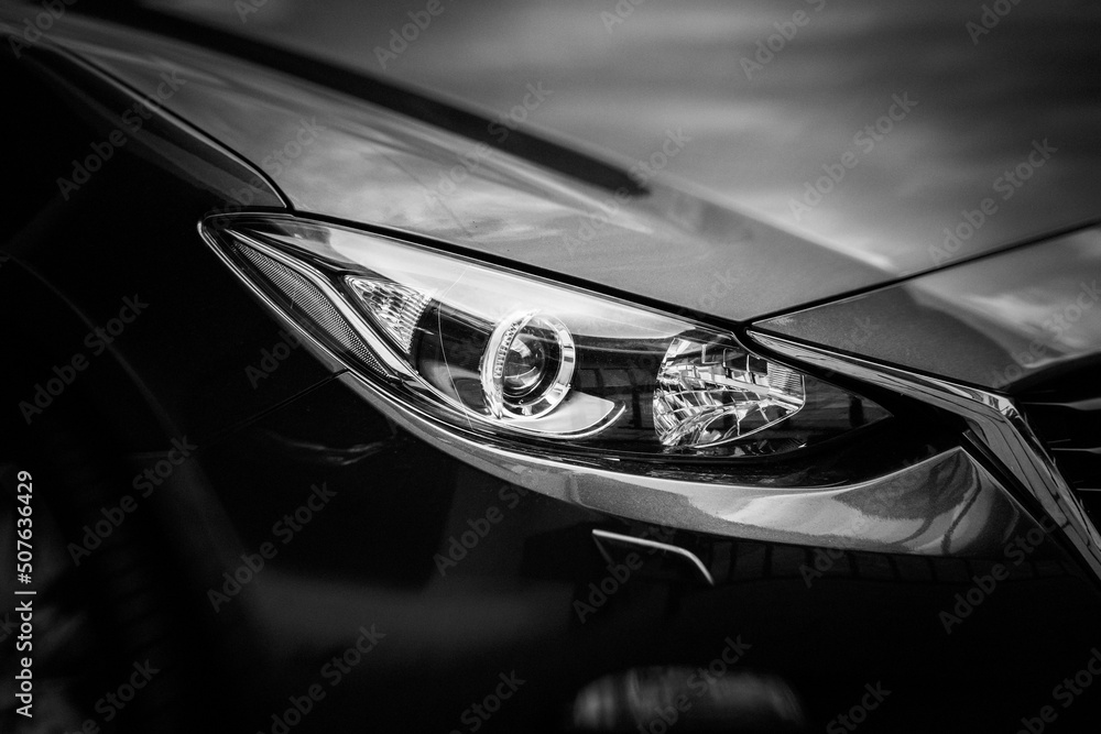 Modern car headlight close-up. Close up of new modern car headlamp ...
