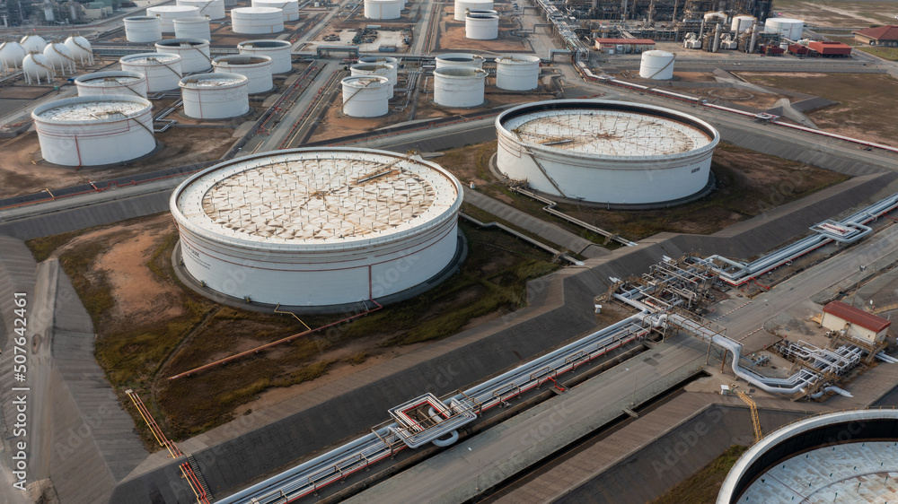 Aerial view fuel reservoirs petroleum industrial zone and metal exhaust ...