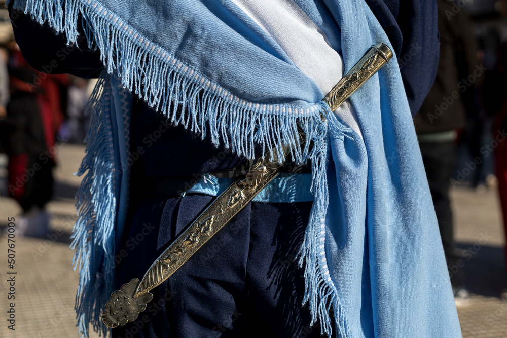 Rear view in detail of the traditional belt and knife (facon) of an ...