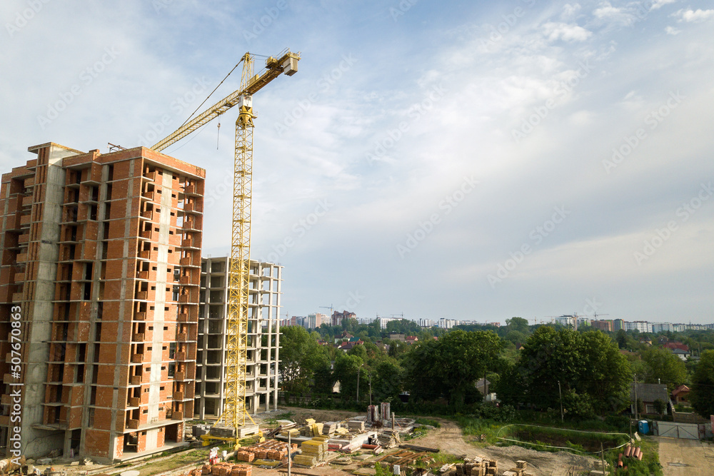 High-rise residential apartment buildings and tower crane under ...