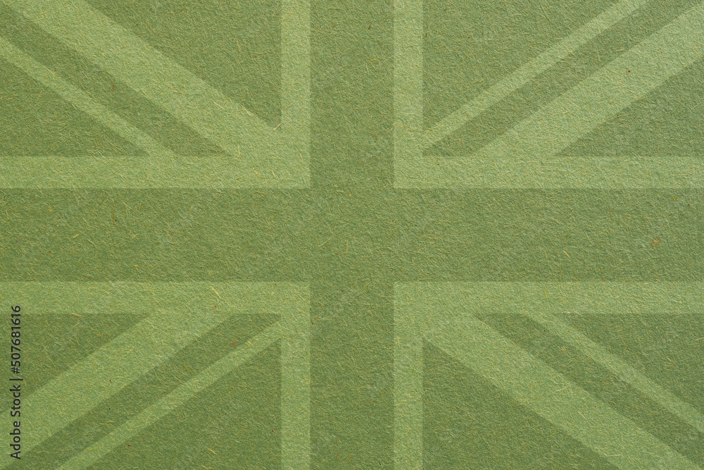British flag outline on green cardboard surface. Paper texture with ...