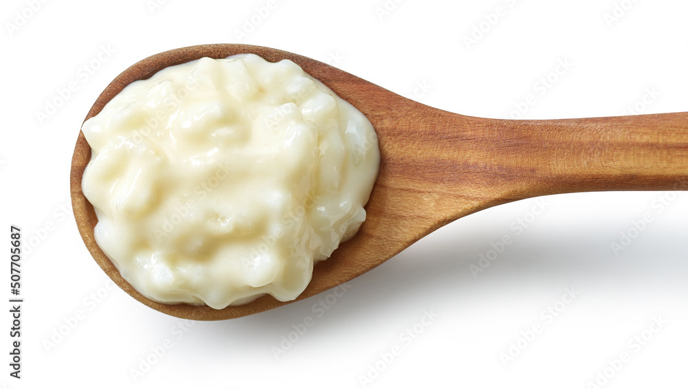 rice pudding in wooden spoon Stock Photo | Adobe Stock