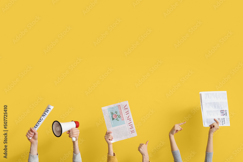 People with newspapers and megaphone on yellow background Stock Photo ...