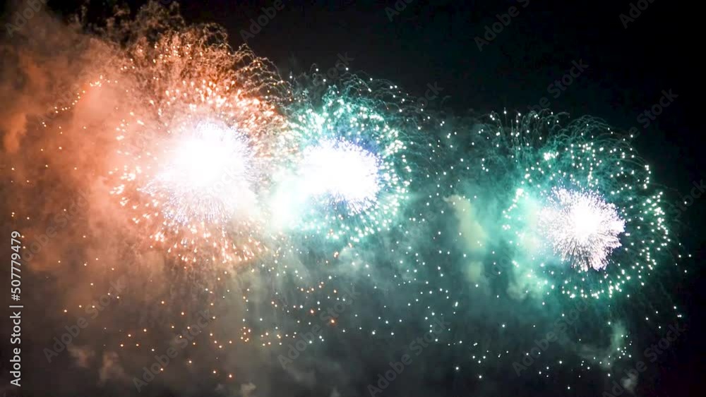 Glowing fireworks in the night sky on the eve of the holiday. Stock ...