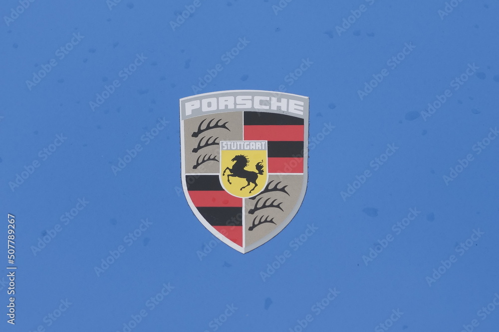 Prsche vintage sports car logo brand text on racing car exposed in the ...