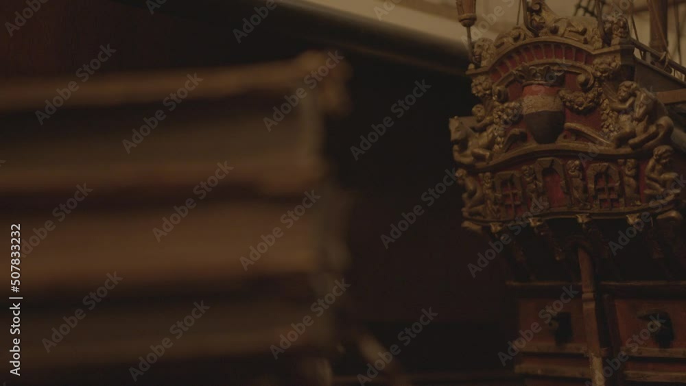 Antique books and pirate ship in library. Stock Video | Adobe Stock