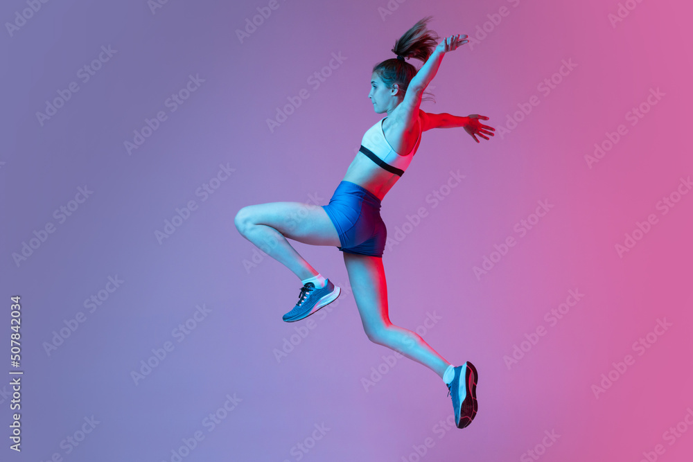 Training in long jump sport. Young girl, female athlete practicing ...