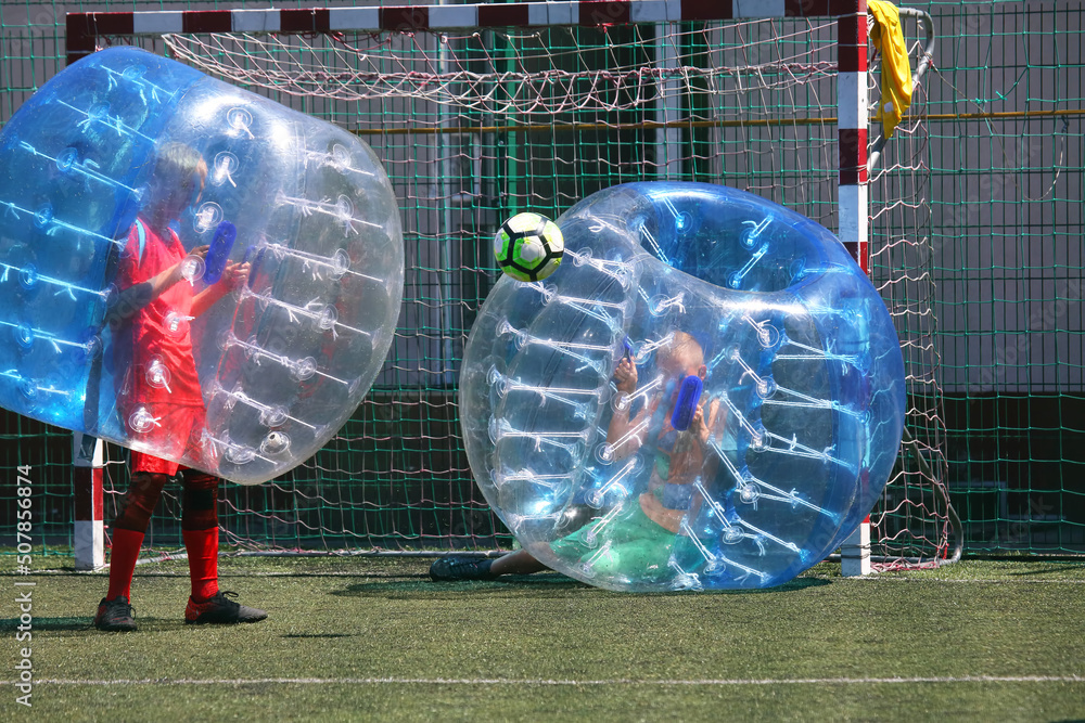 football ball game in inflatable transparent spheres. sports and ...