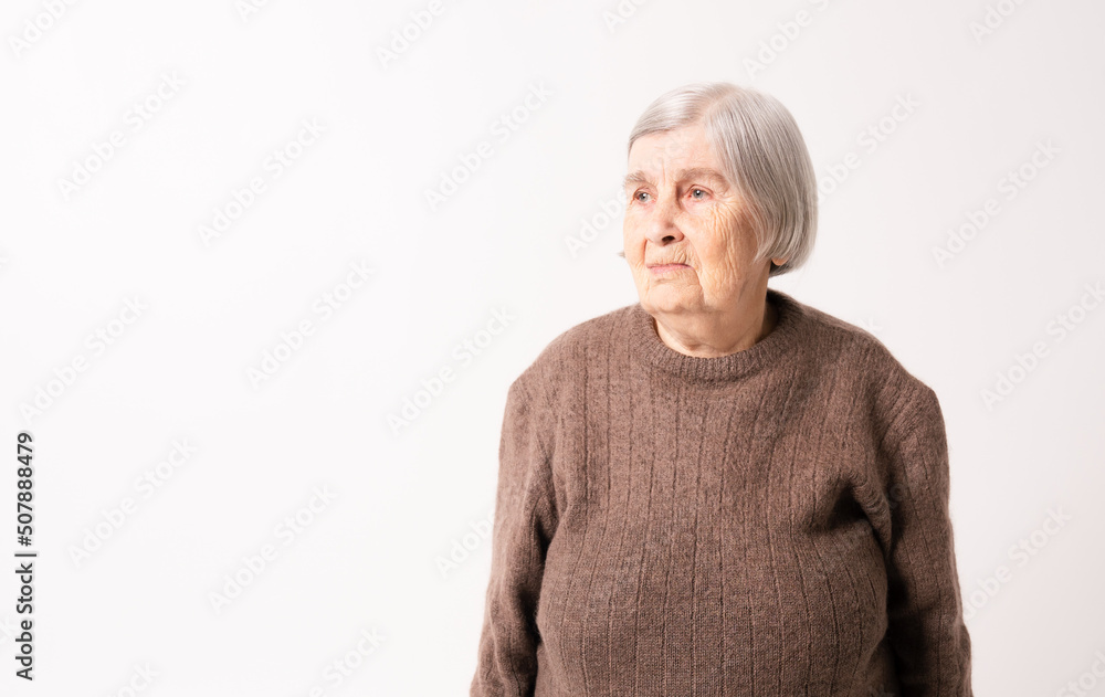 Octogenarian lady portrait. Old woman with gray hair on a light ...