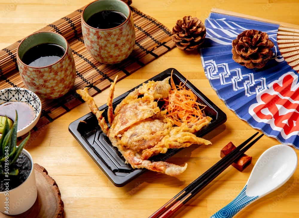 deep fried soft shell crab served in dish with black coffee side view ...