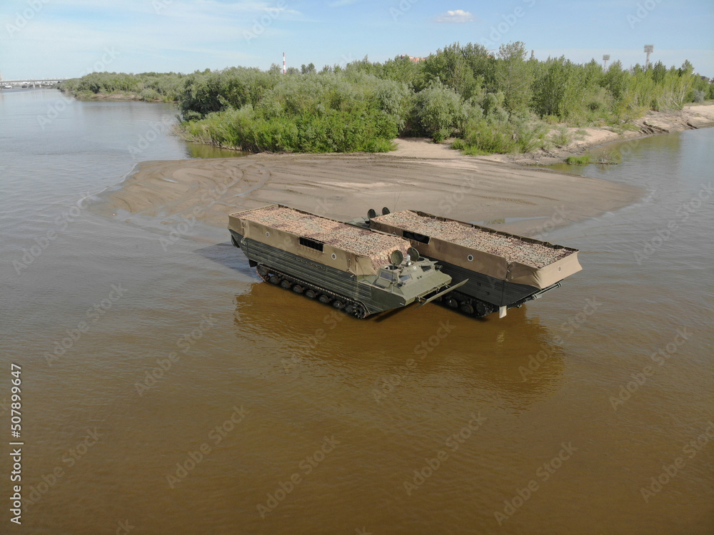 Russian military floating crawler transporters resting on the beach on ...