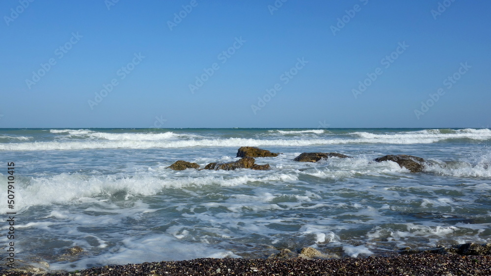 The Black Sea near Vama Veche in Romania. Steady waves coming towards ...